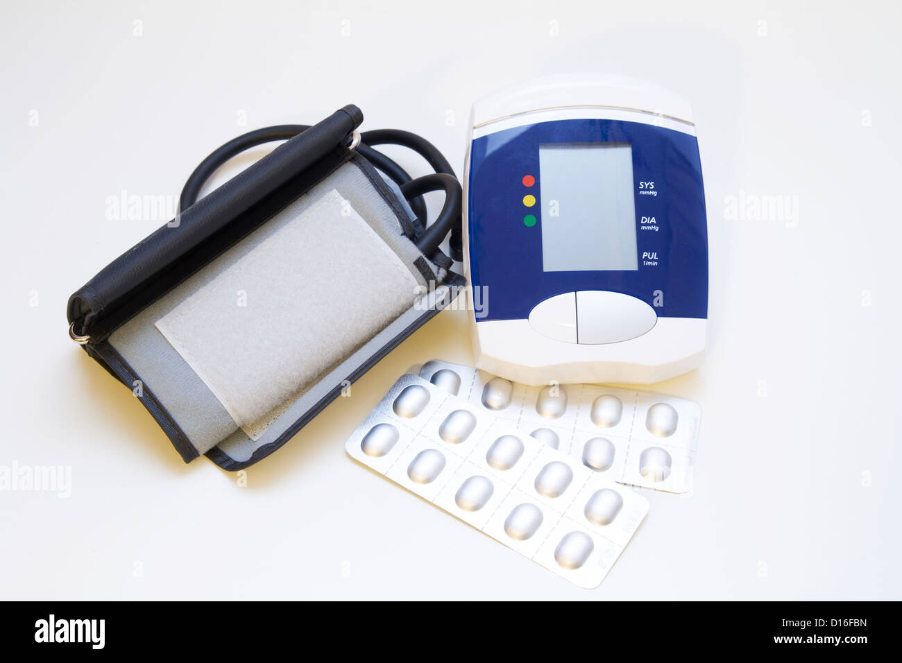 Blood pressure monitor on white background Stock Photo - Alamy