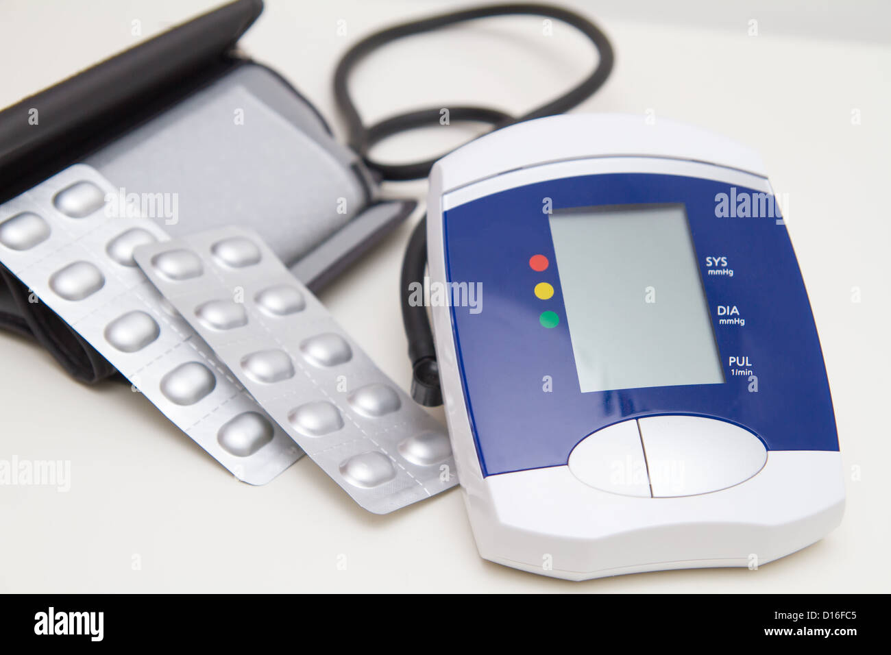 Blood pressure monitor on white background Stock Photo - Alamy