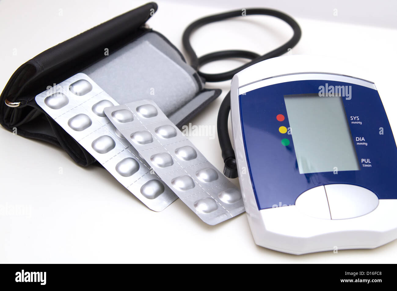 Blood pressure monitor on white background Stock Photo - Alamy