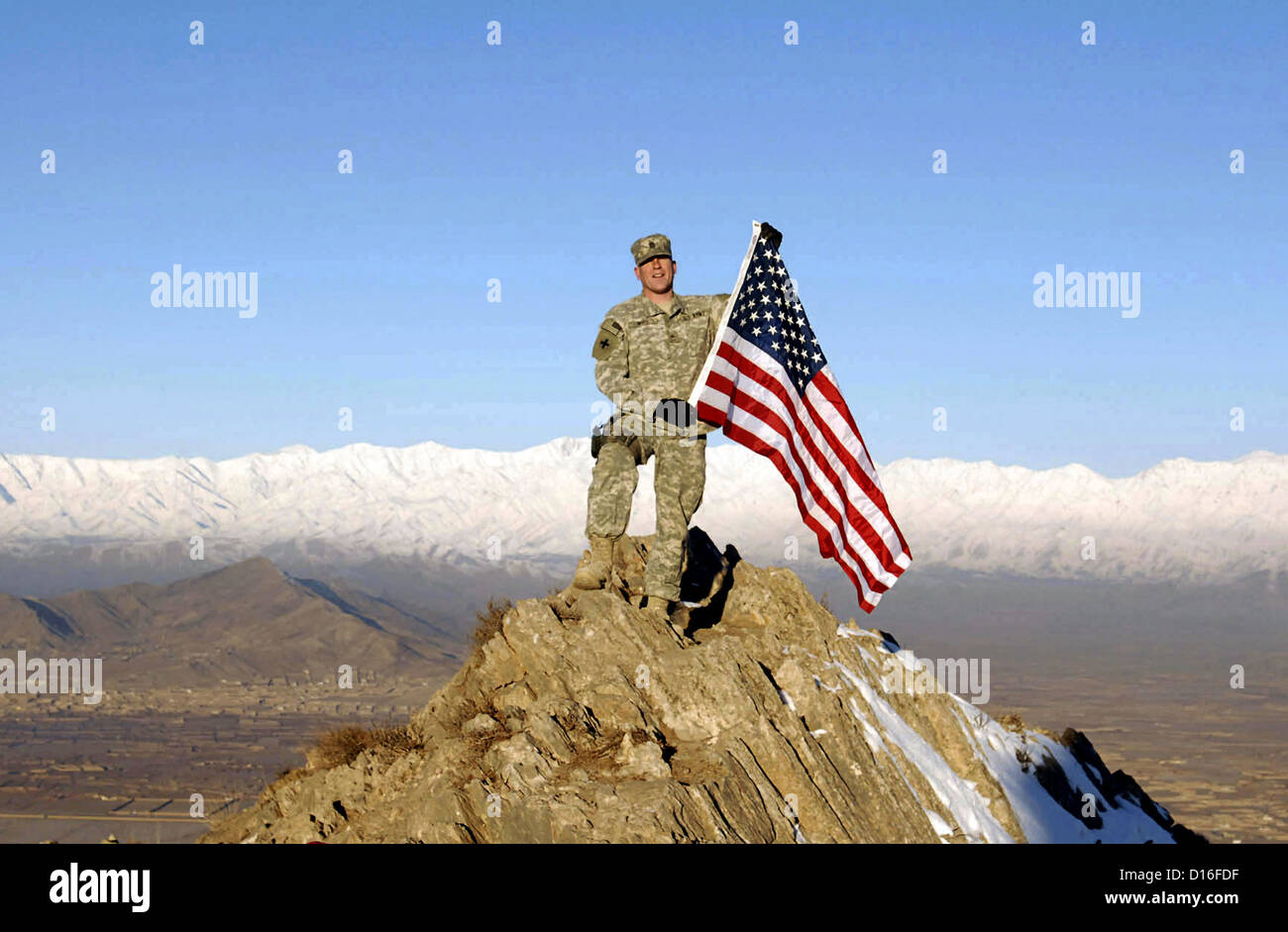 A US Army soldier stands atop Ghar Mountain at Kabul Military Training ...