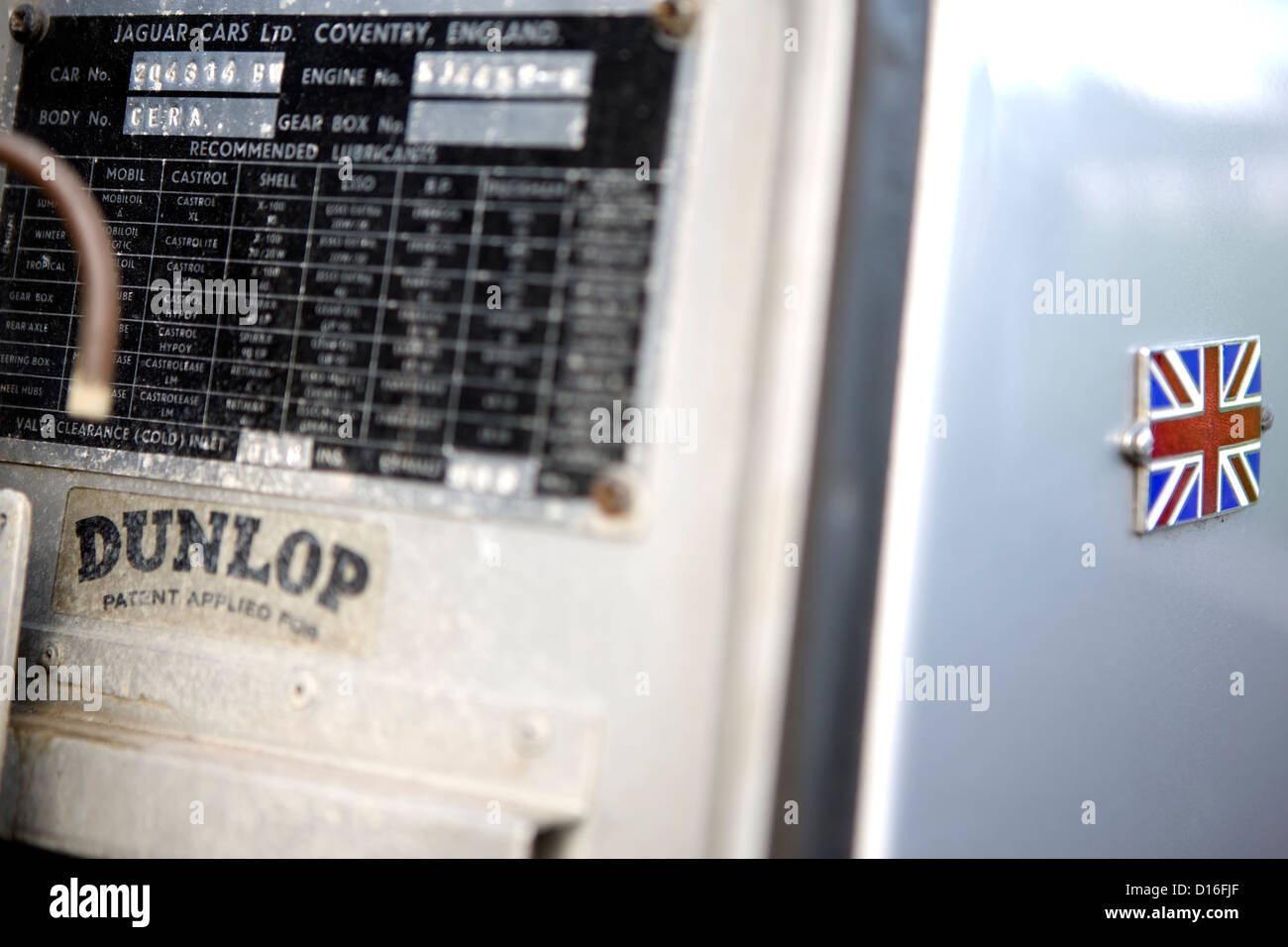 A Dunlop sticker under the bonnet of a classic car Stock Photo - Alamy