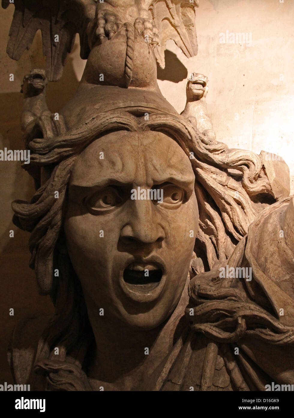 Angry expression on the face of a statue at the Arc de Triomphe, Paris ...