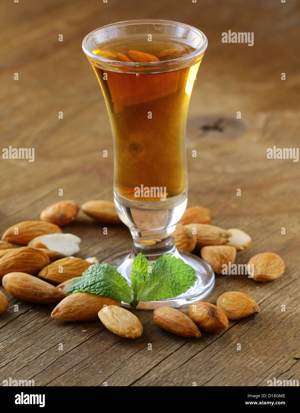 Almond liquor amaretto with whole nuts Stock Photo - Alamy