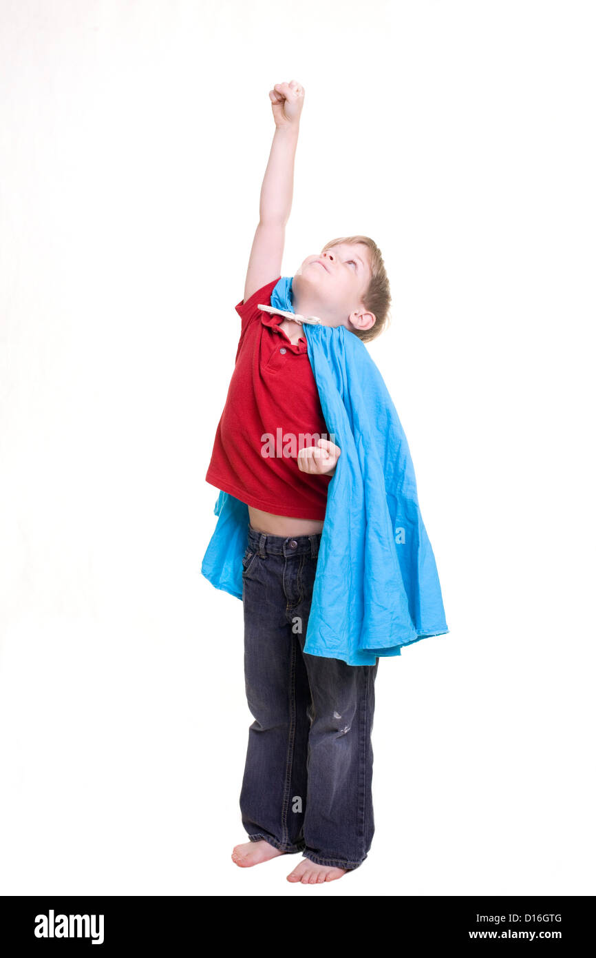 A boy with a cape pretending to fly Stock Photo - Alamy