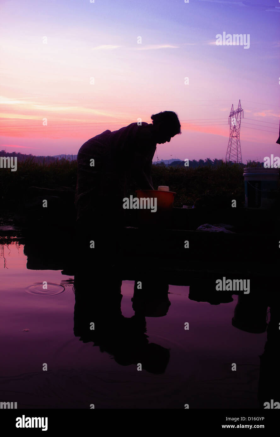 Silhouette of person and water reflection Stock Photo - Alamy