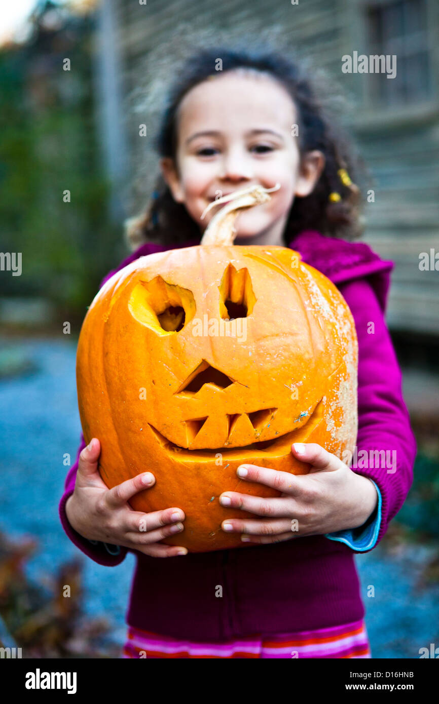 Girl carrying a pumpkin hi-res stock photography and images - Alamy