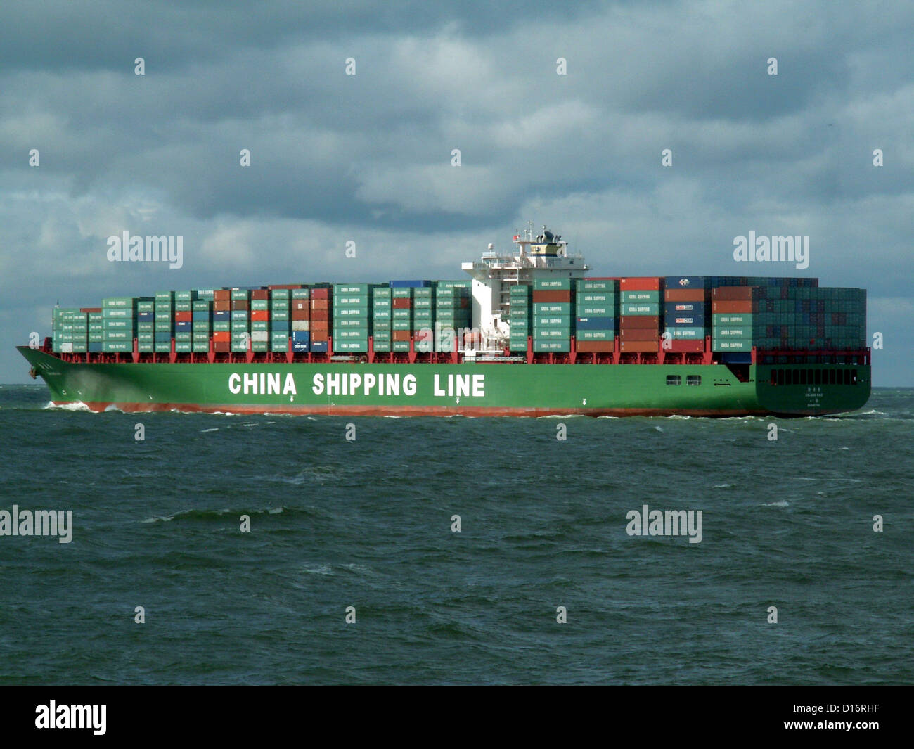 The Xin Qing Dao, a container ship, departs from the Port of Rotterdam ...