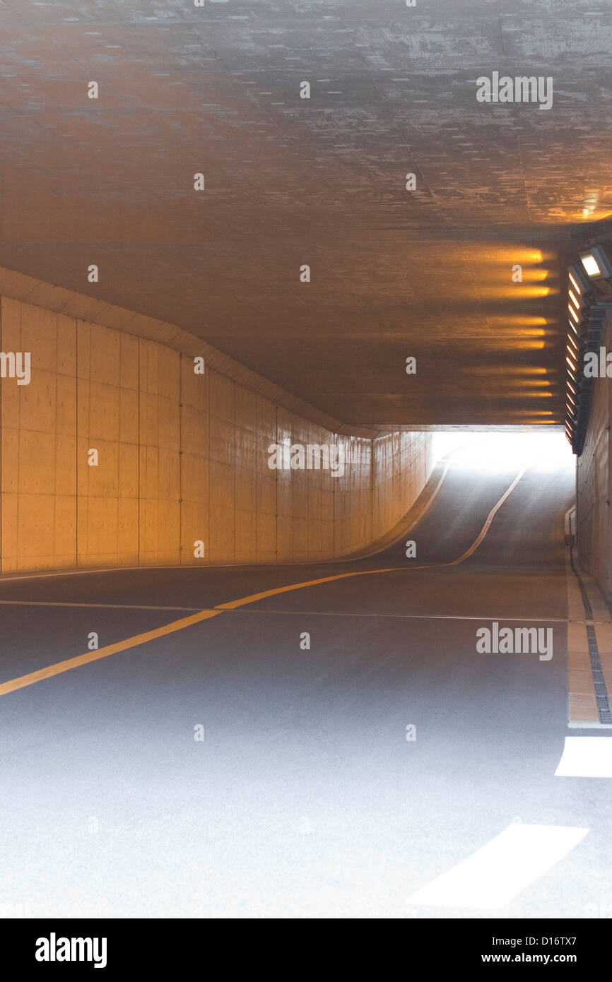 Lighted tunnel under the highway Stock Photo - Alamy