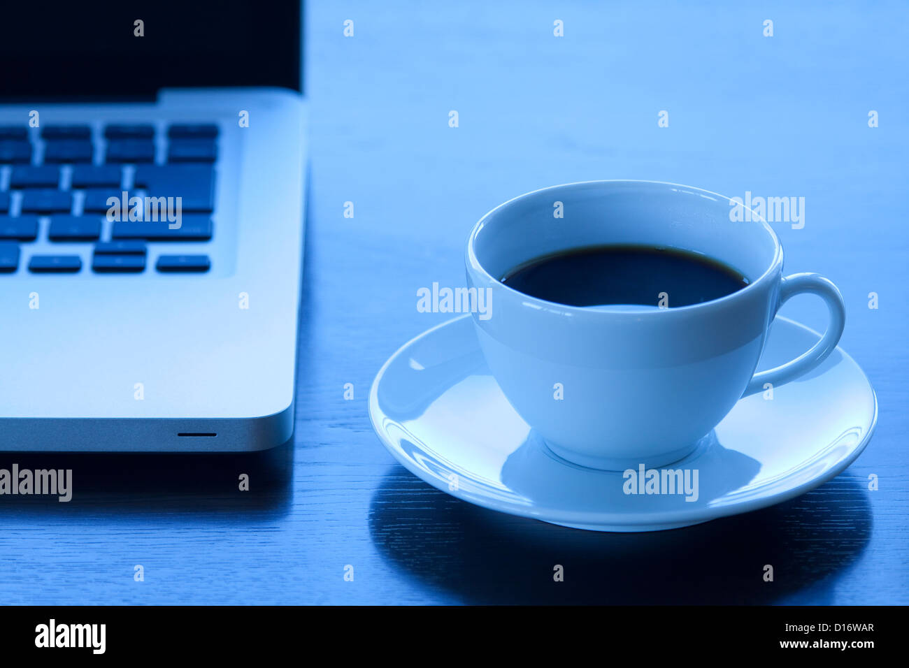 Cup of coffee and laptop Stock Photo - Alamy