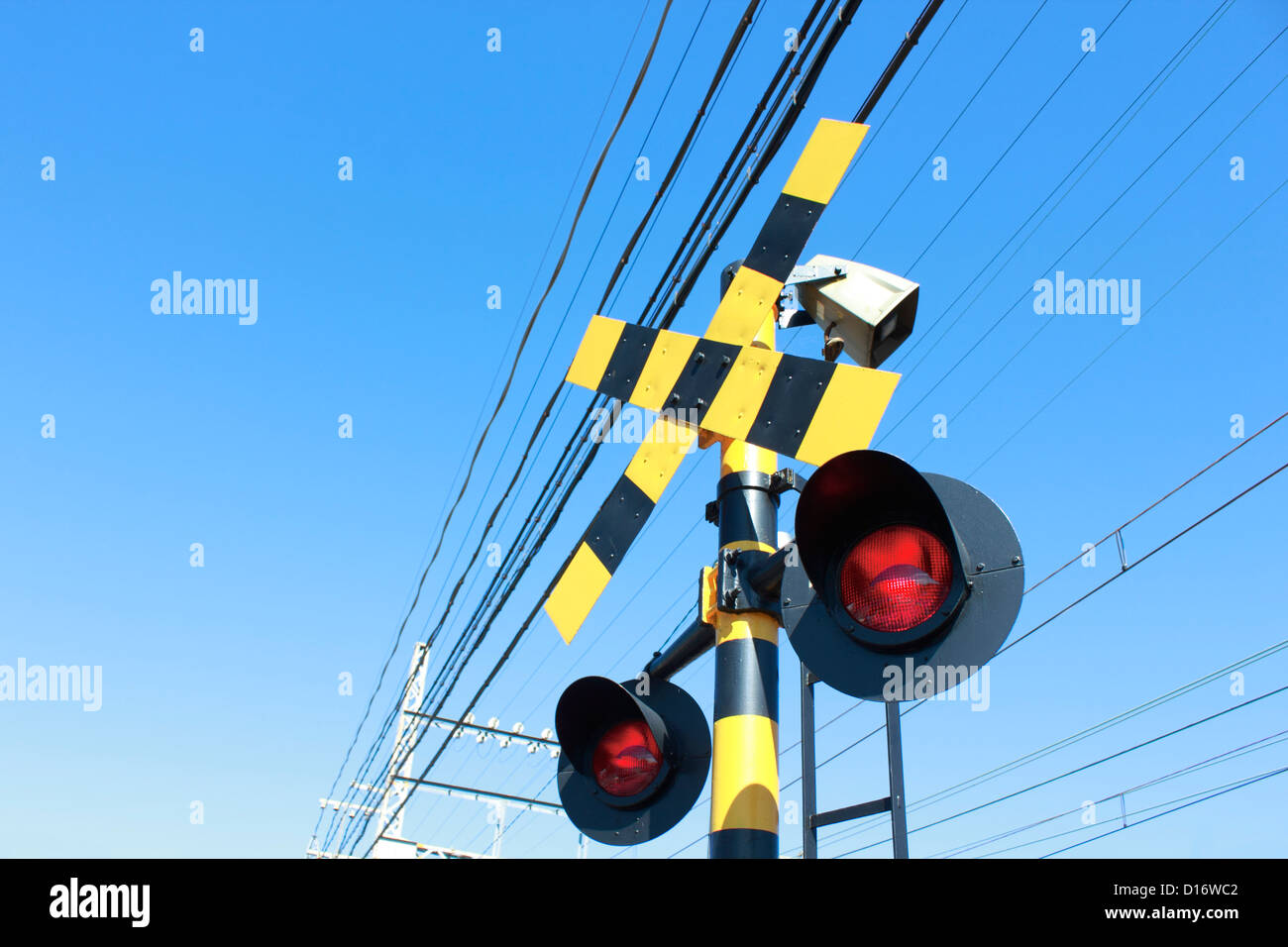 Railroad security light and blue sky Stock Photo - Alamy