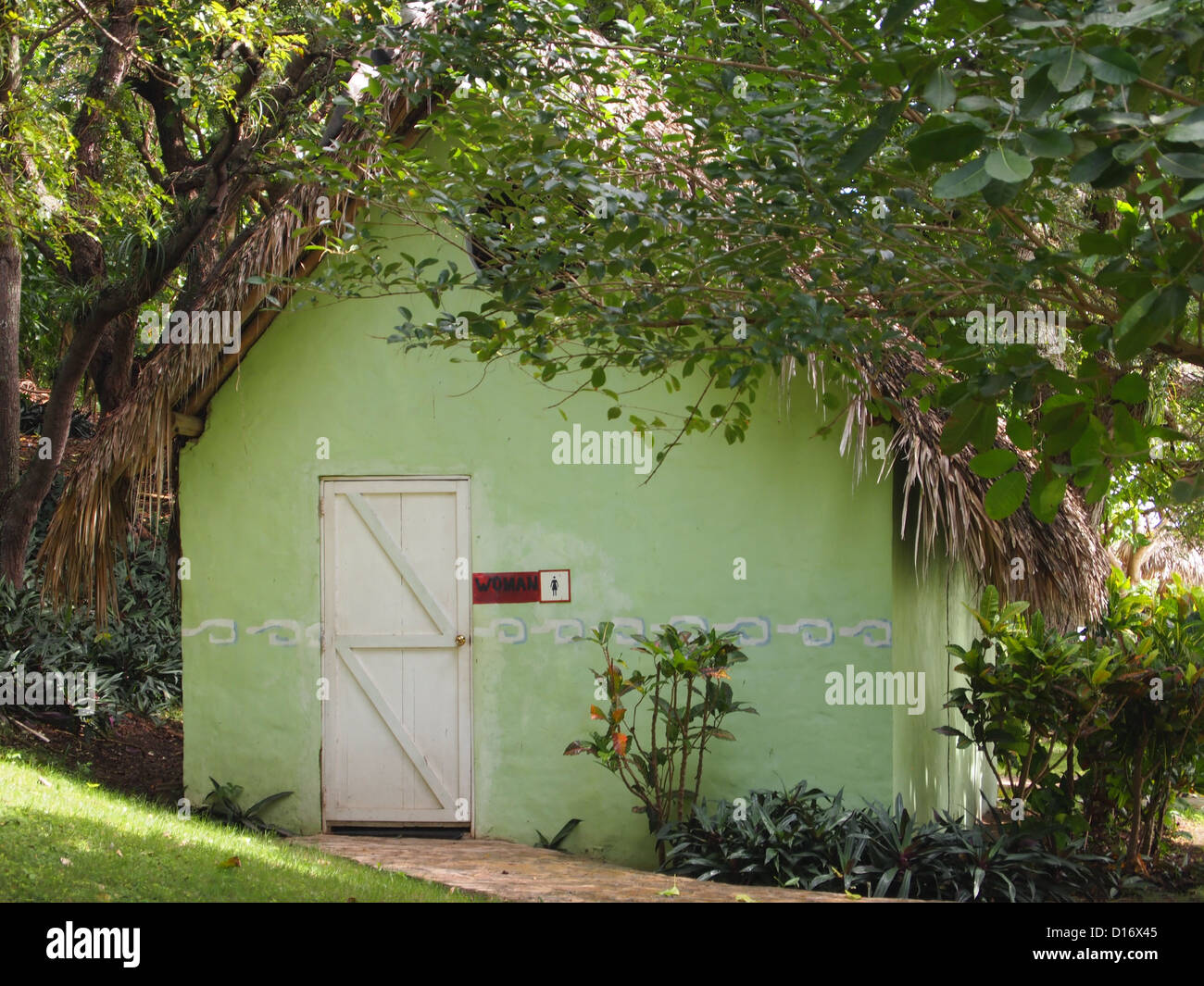 Green thatched house is toilet Stock Photo - Alamy