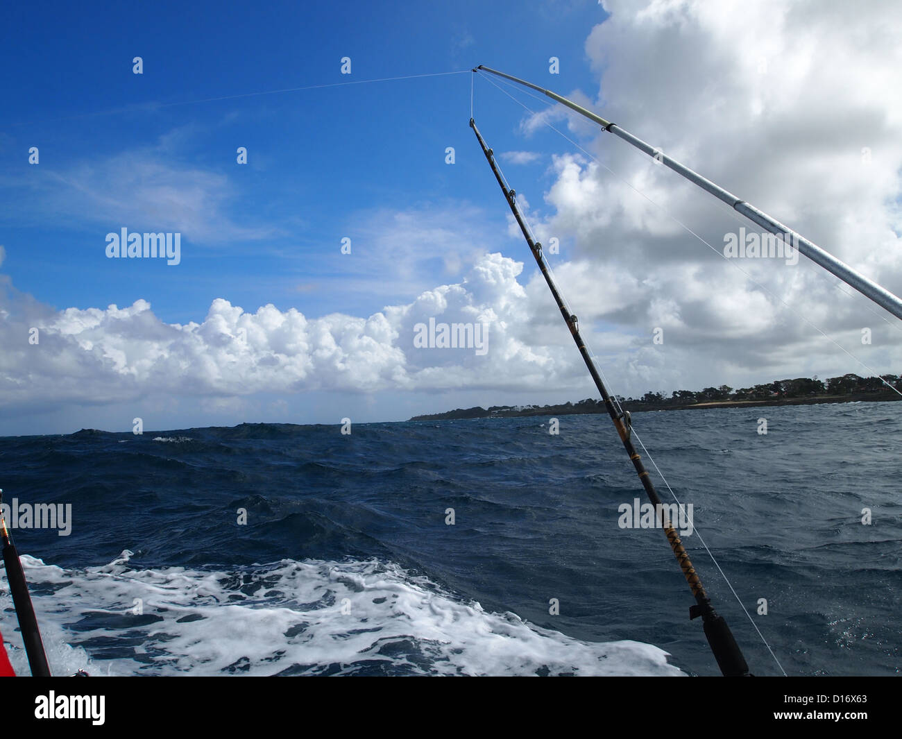 Fishing rods on a boat Stock Photo - Alamy