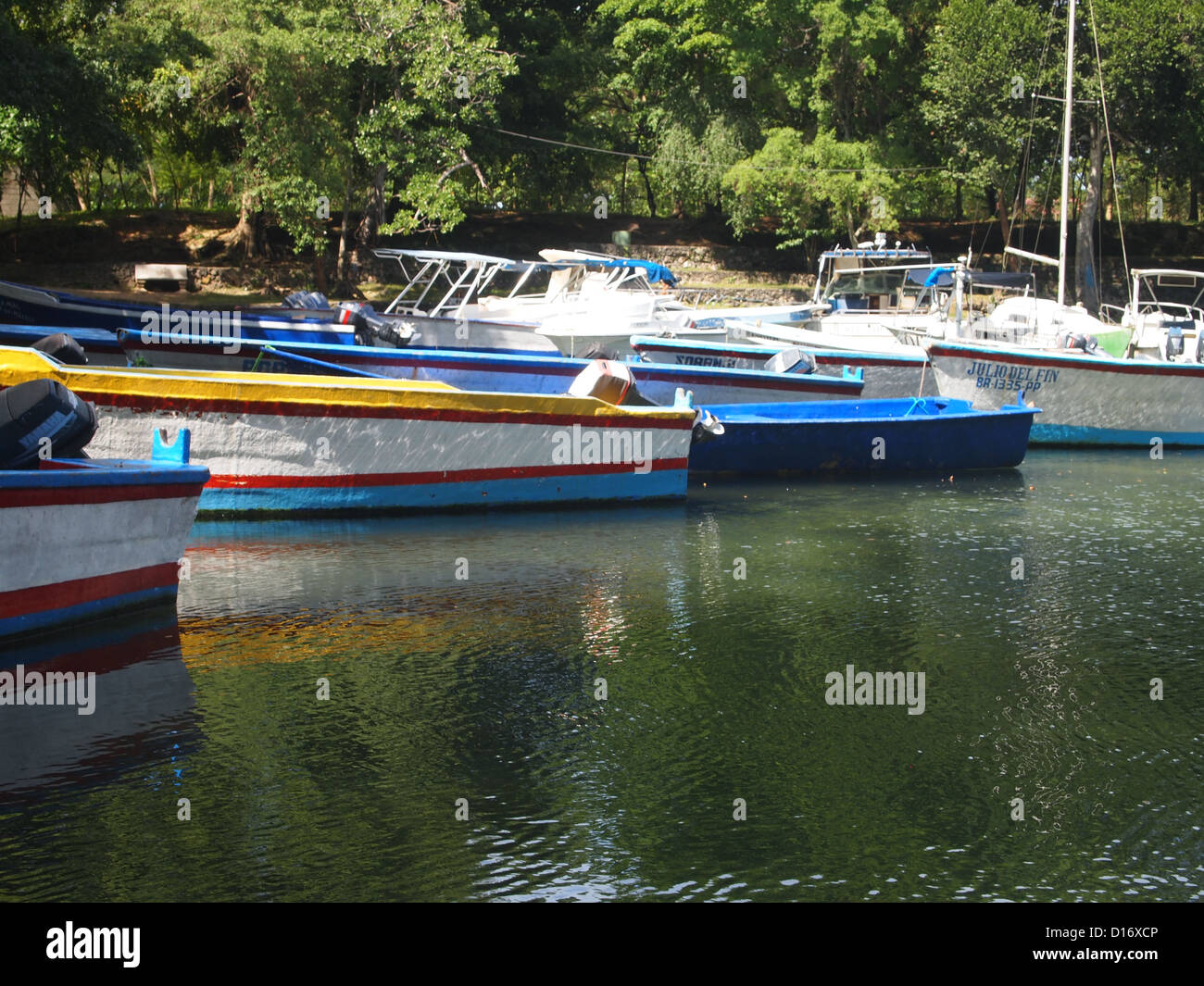 Many nice boats in a calm bay Stock Photo - Alamy