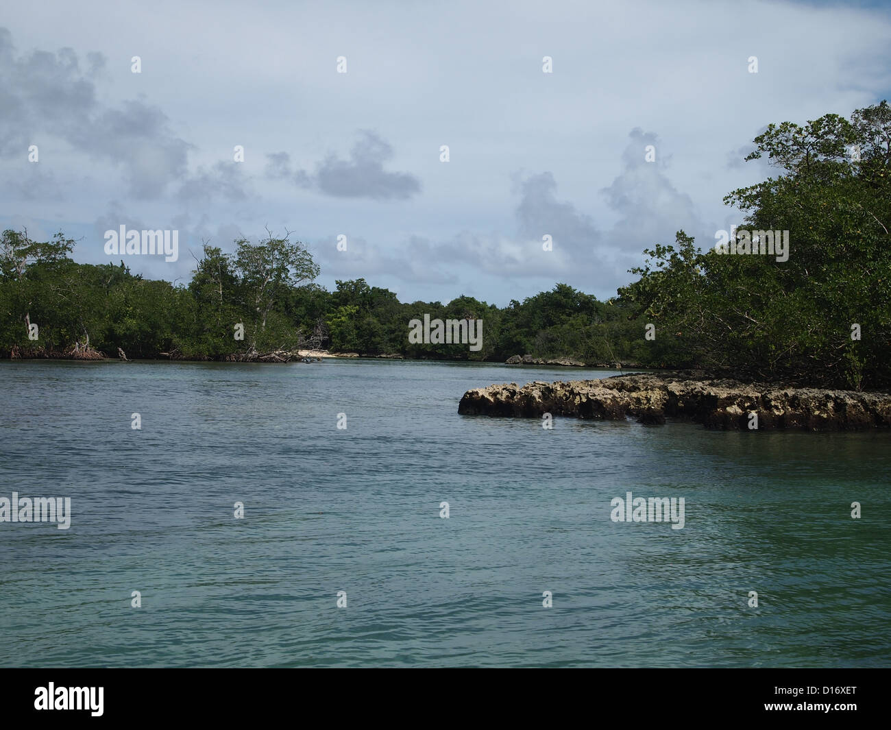 A rocky pier in a lonely bay Stock Photo - Alamy
