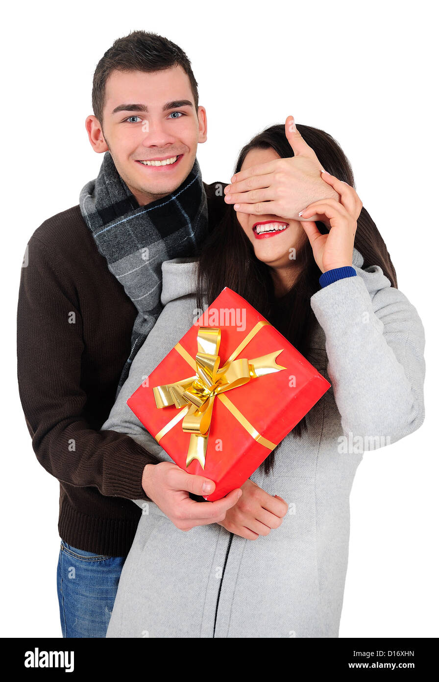 Isolated young casual couple giving gift Stock Photo - Alamy