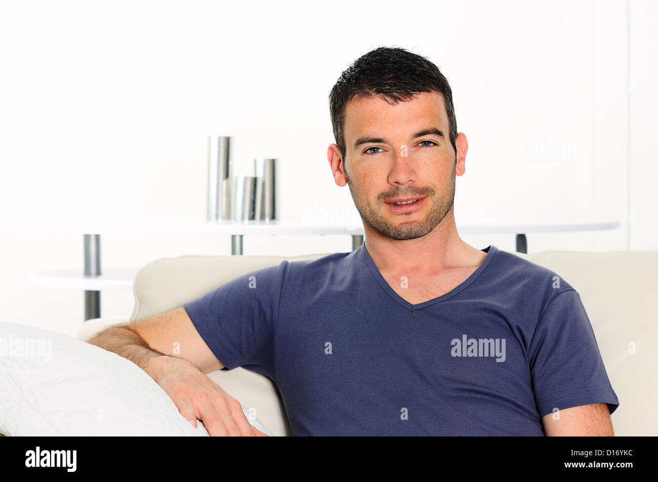 natural and relaxed looking young man Stock Photo - Alamy