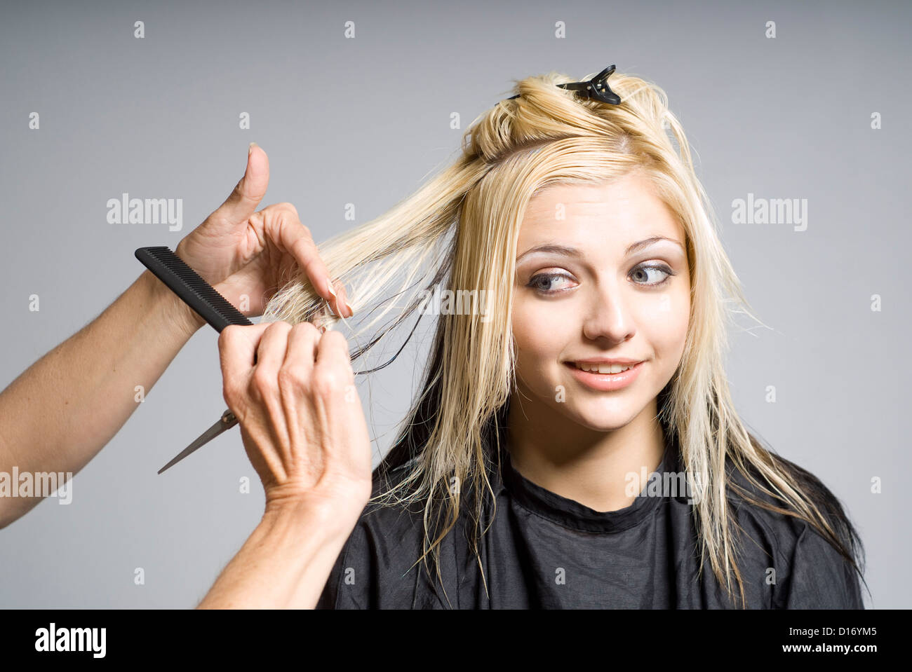 Cutting hair unsure hi-res stock photography and images - Alamy