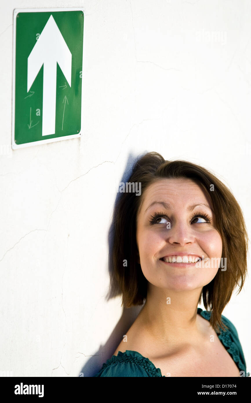 Berlin, Germany, laughing young woman in front of Arrow icon Stock ...