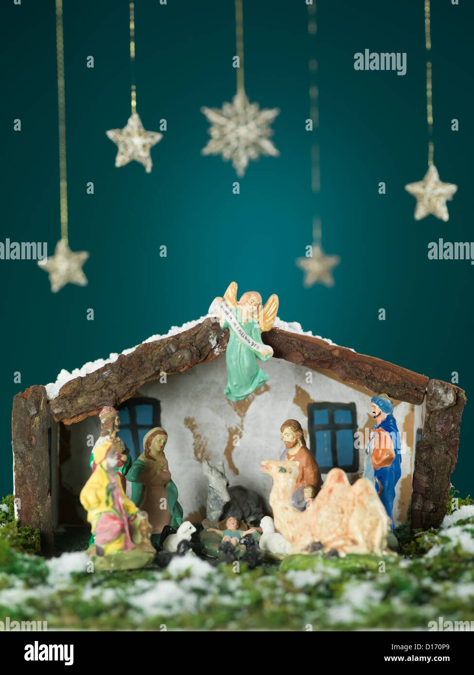 closeup of birth of baby jesus scene with wooden figurines, snow and ...