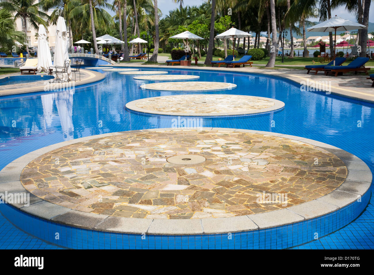 Open air swimming pool in the tropical garden Stock Photo - Alamy