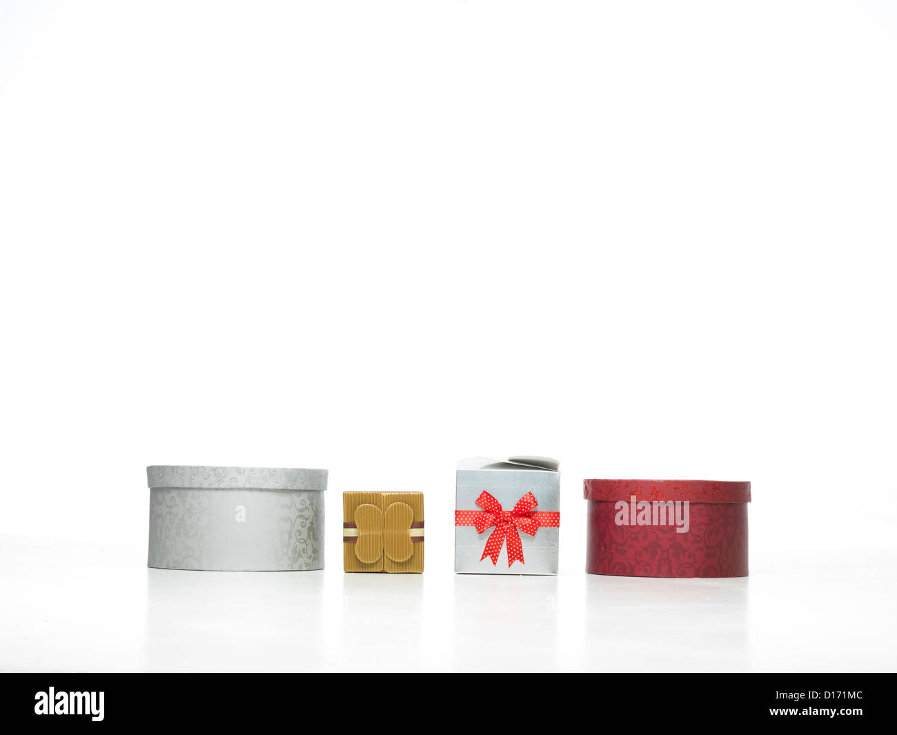 colorful different shaped gift boxes in a row with glittery decorations ...