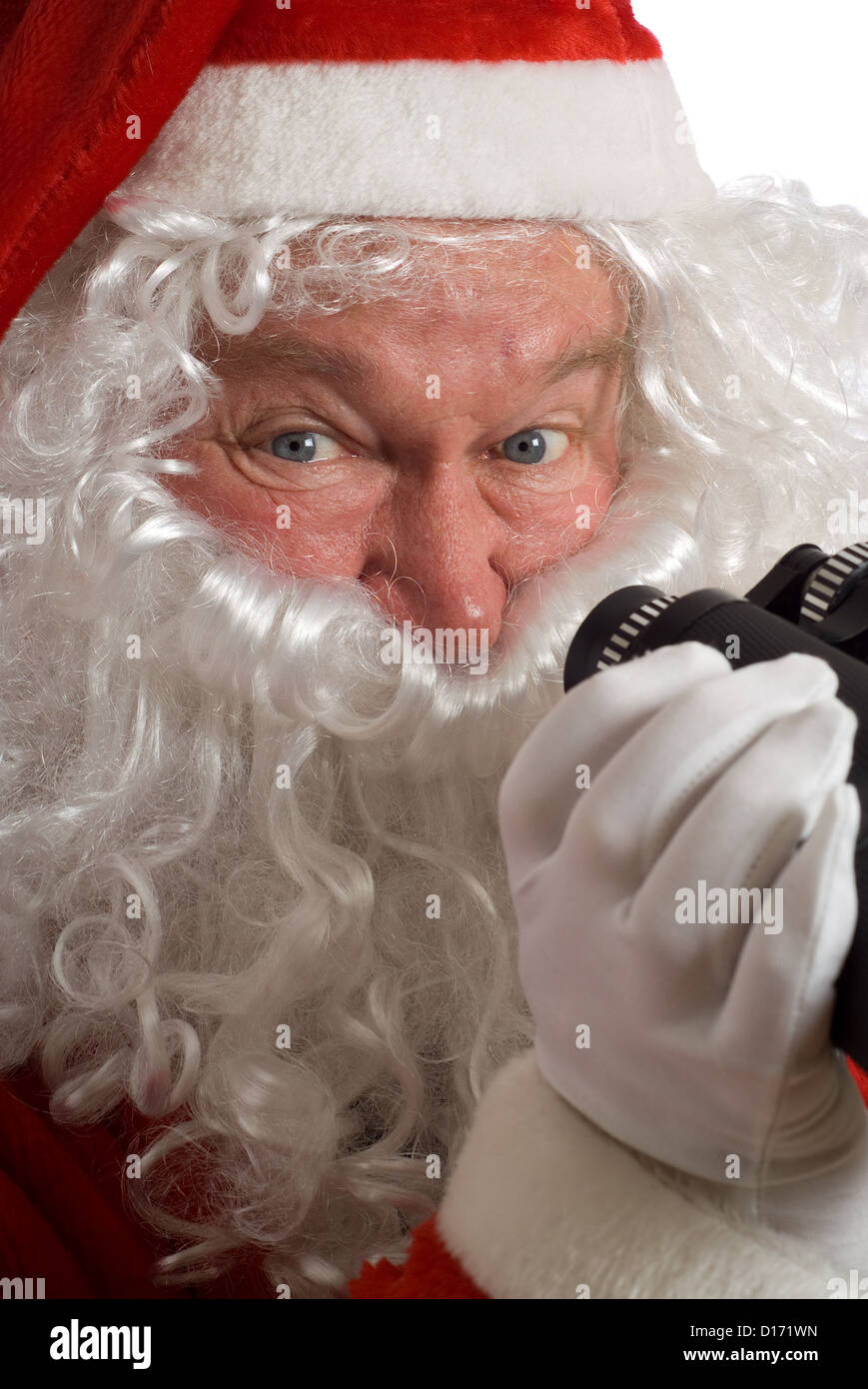 Close up Father Christmas with a jolly look in his eye and binoculars ...