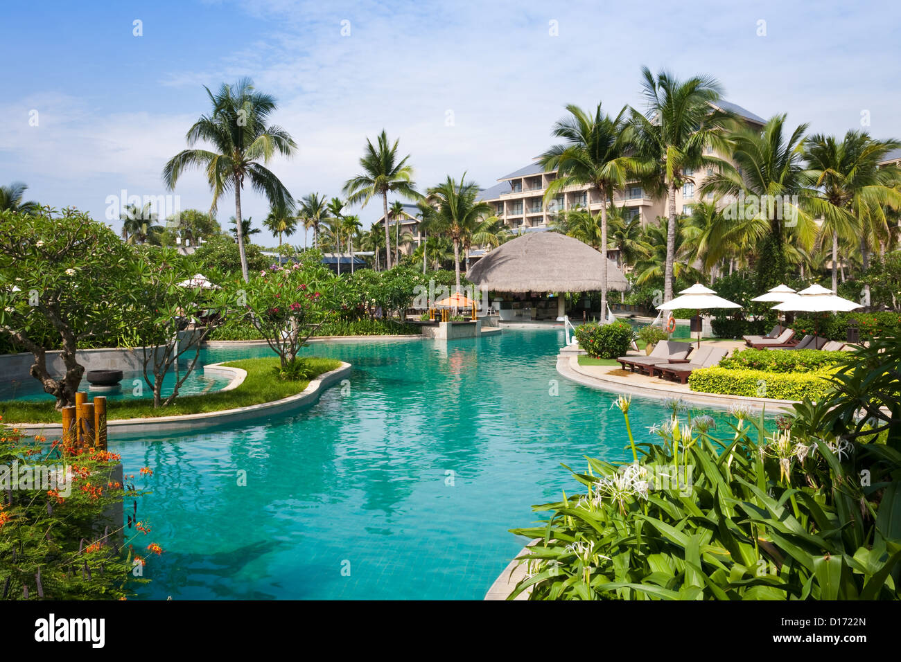 Luxury swimming pool at tropical resort Stock Photo - Alamy