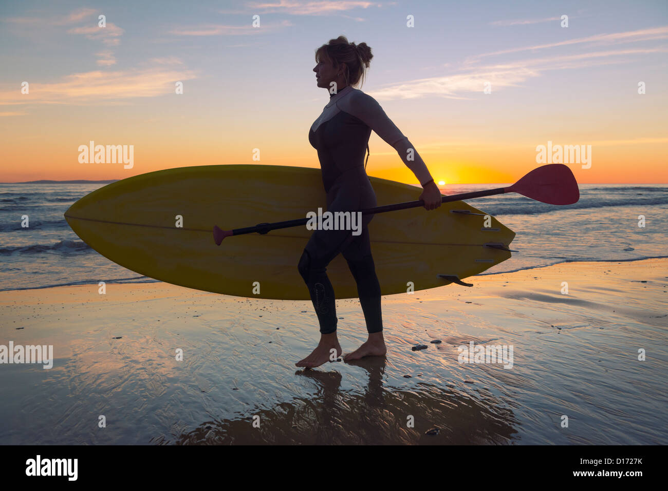 Woman with a stand up paddle surf board. Tarifa, Costa de la Luz, Cadiz ...