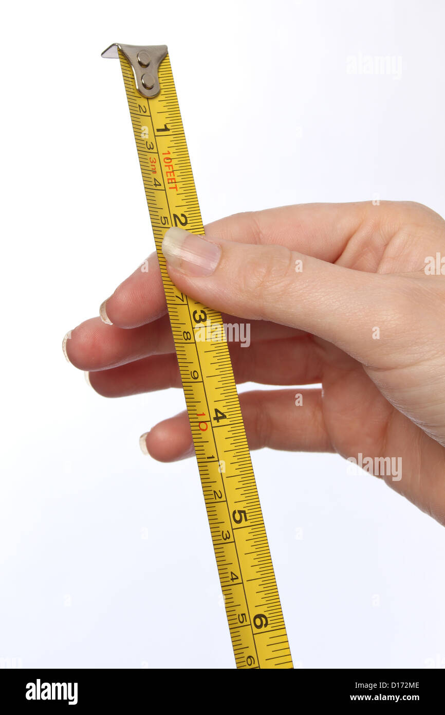close up of a hand holding a tape measure Stock Photo - Alamy