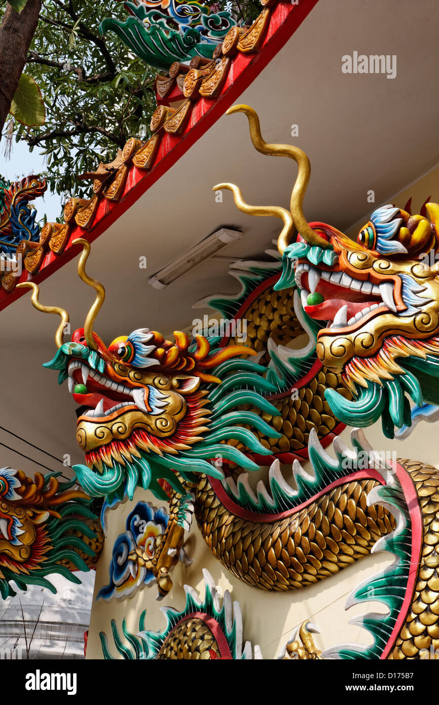 Thailand, Bangkok, a religious dragon statue close to a buddhist temple ...