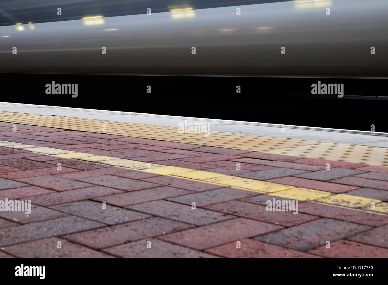 Platform level view of high speed Pendolino train passing through a ...