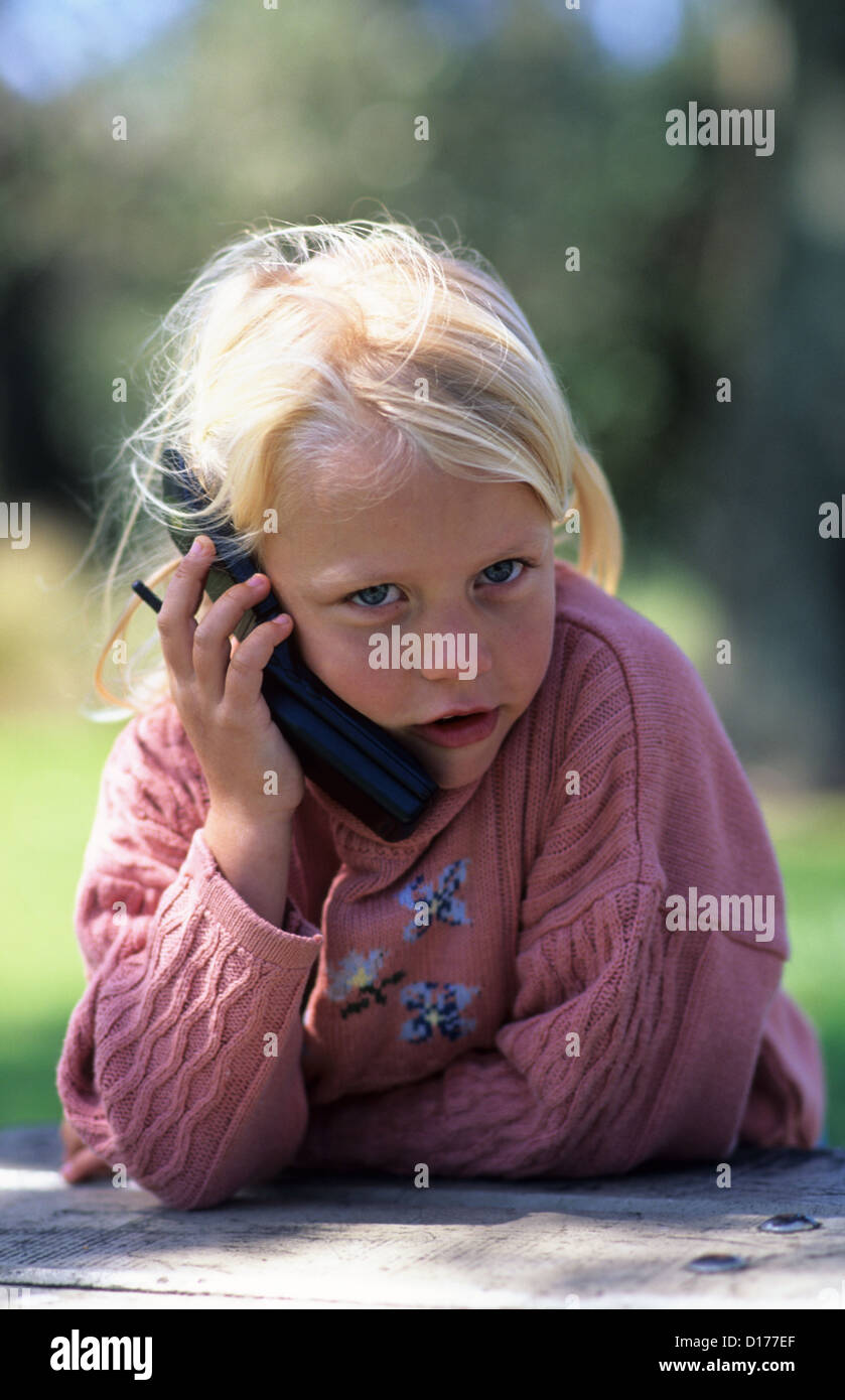 Child making a phone call Stock Photo - Alamy