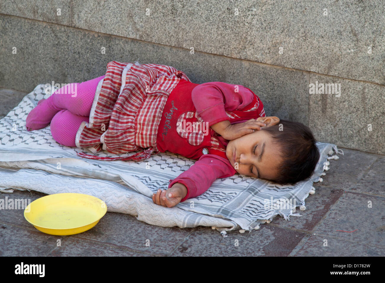 Child begging in streets hi-res stock photography and images - Alamy
