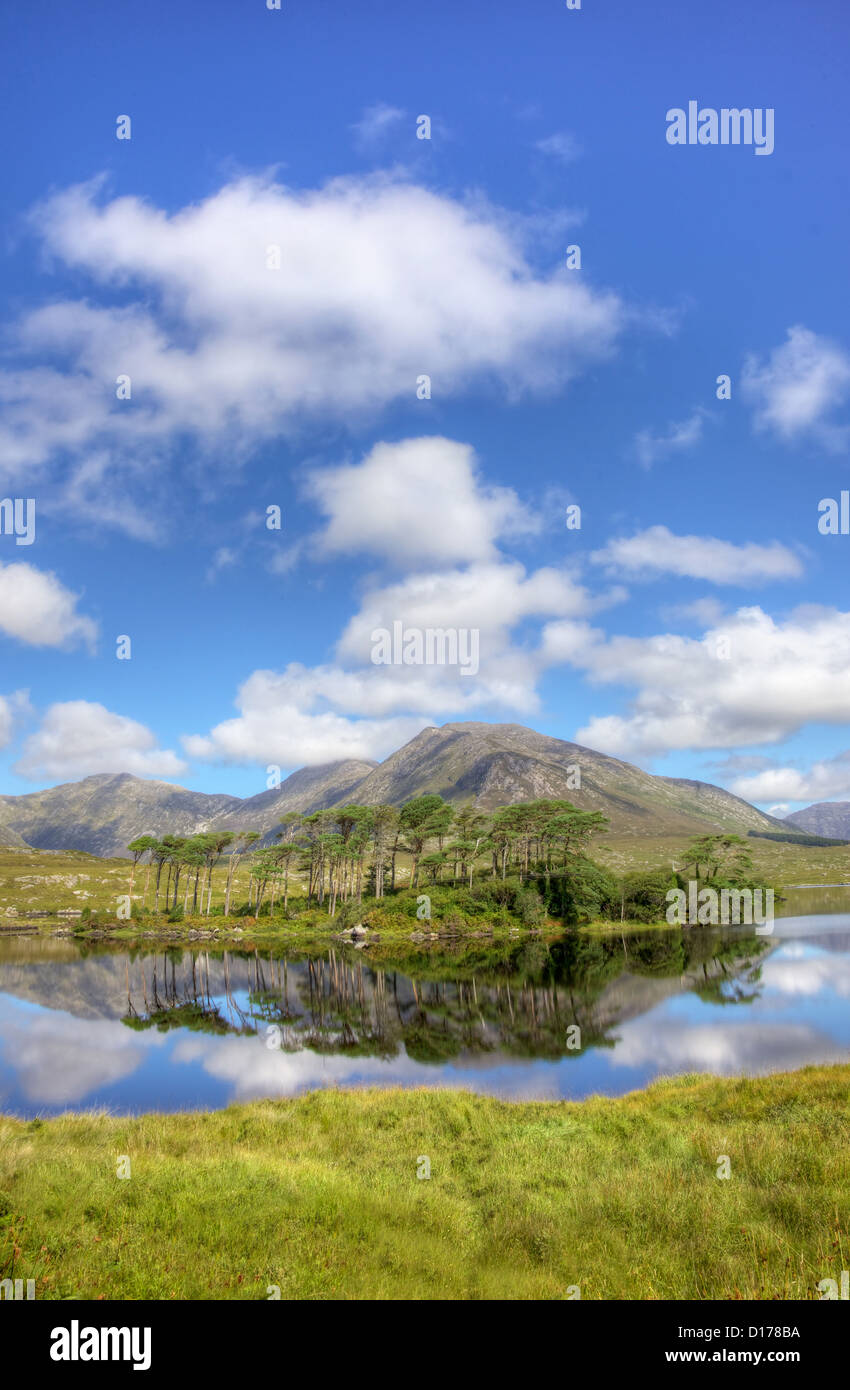 Mountainous landscape reflected in Derryclare Lough, in the Inagh ...