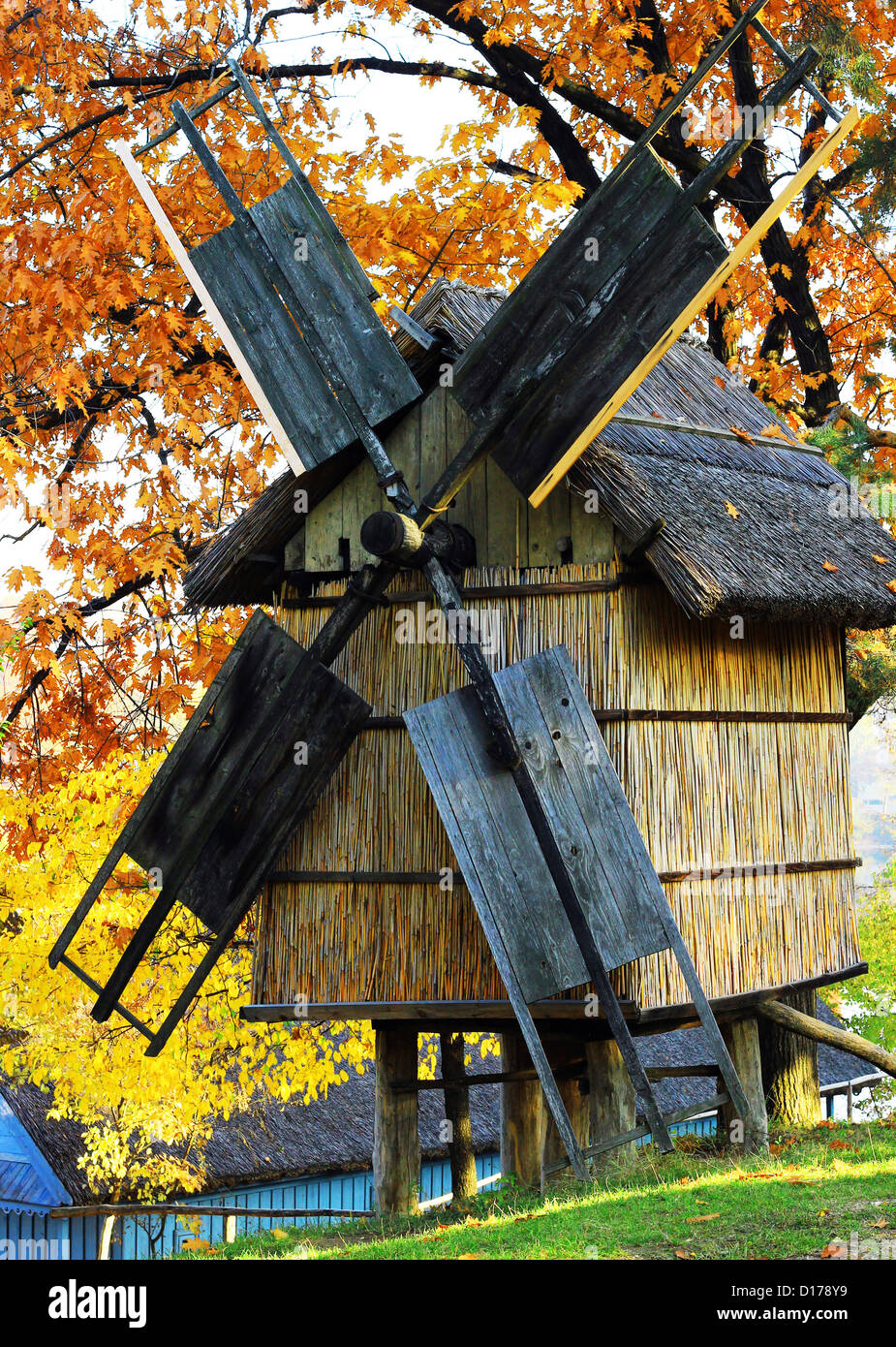 Old windmill with autumn trees in the background Stock Photo - Alamy
