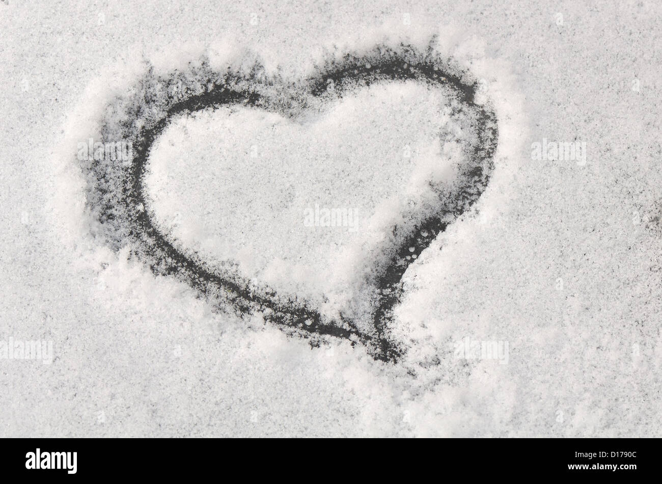 heart drawn on the snowy ice Stock Photo - Alamy