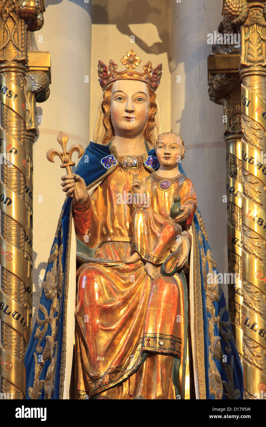 Wood carved religious statue of Maria holding Jesus inside the Church ...