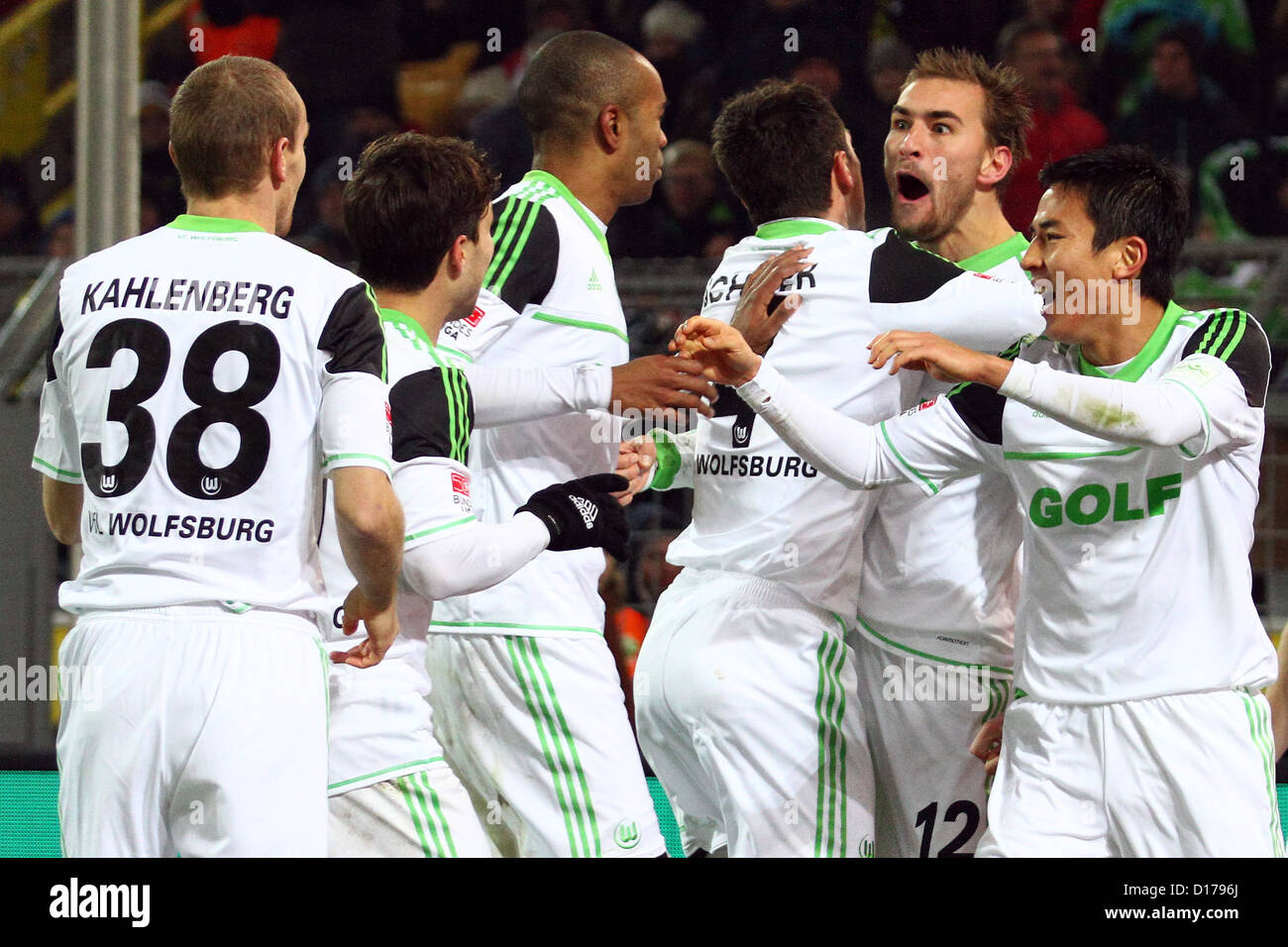 Wolfsburg's Bas Dost (2-R) celebrates his 2-3 goal with teammates ...