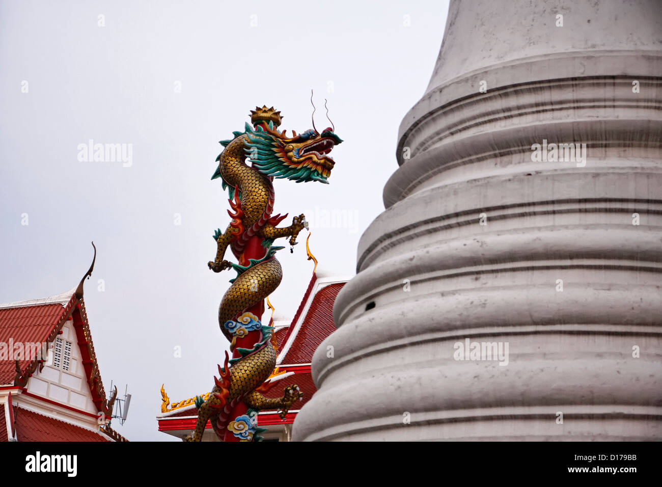 Thailand, Bangkok, a religious dragon statue close to a buddhist temple ...