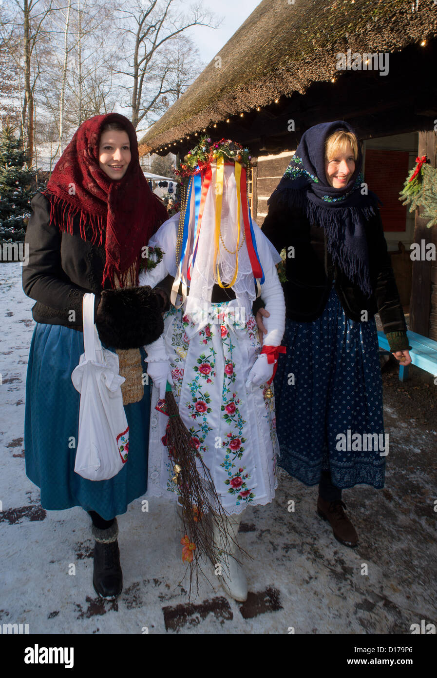 A perosn dressed as the traditional folk figure 'Bescherkind' and two ...