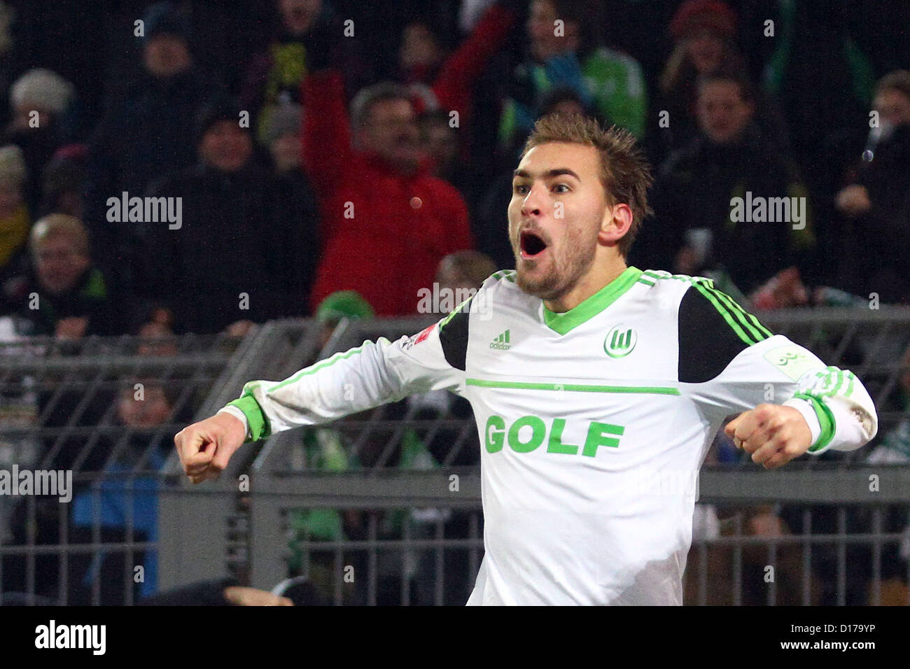 Wolfsburg's Bas Dost celebrates his 2-3 goal during Bundesliga soccer ...