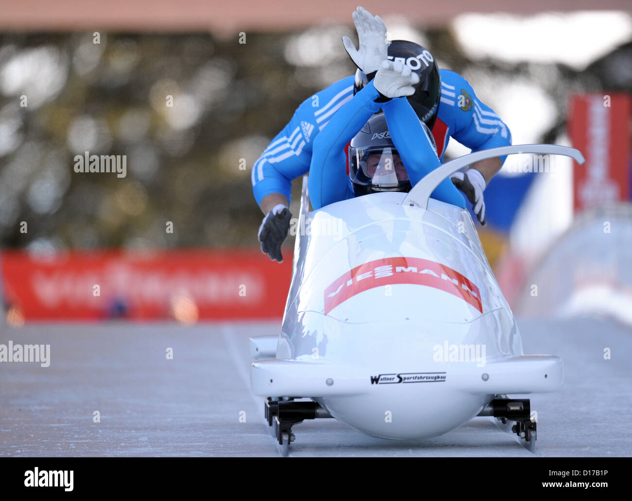 Russian Alexandr Zubkov (front) and Dmitry Trunenkov race in the 2012 ...