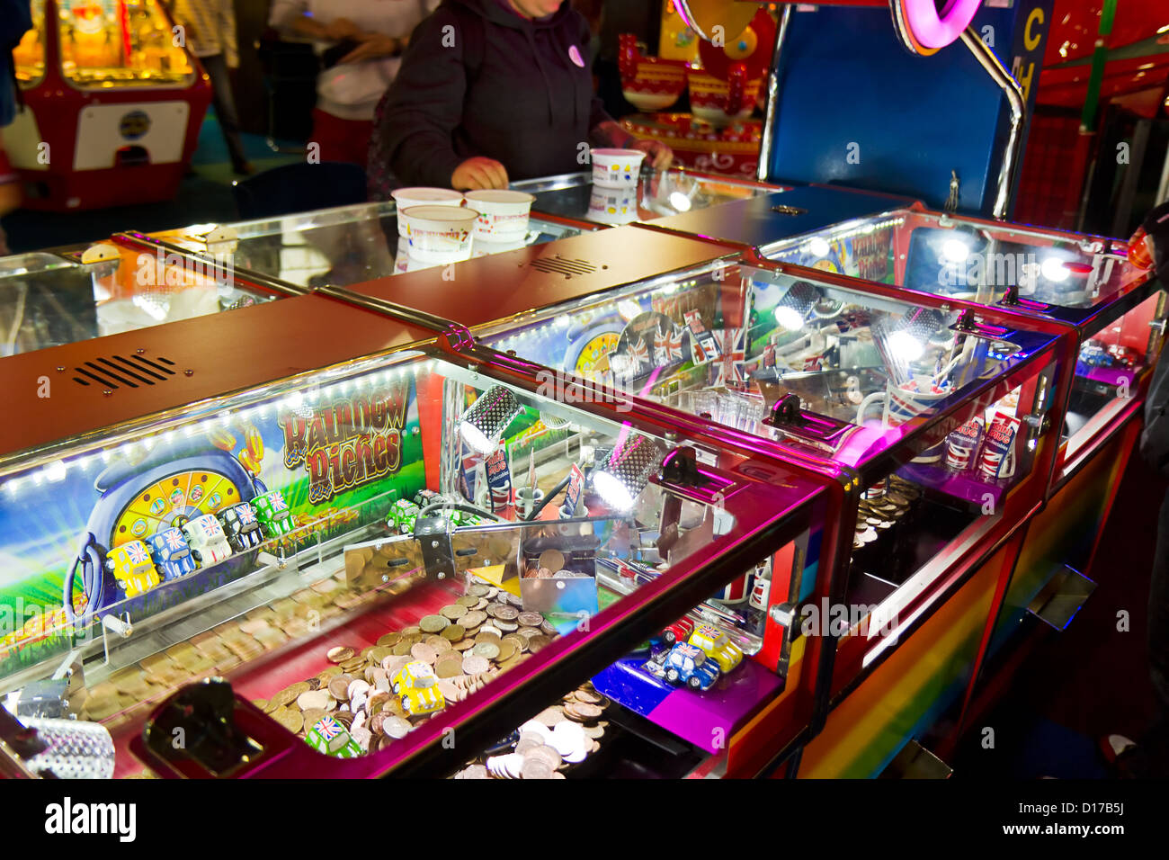 BRIGHTON, UK-SEPTEMBER 1st, 2012: Someones plays on a Penny pusher game ...