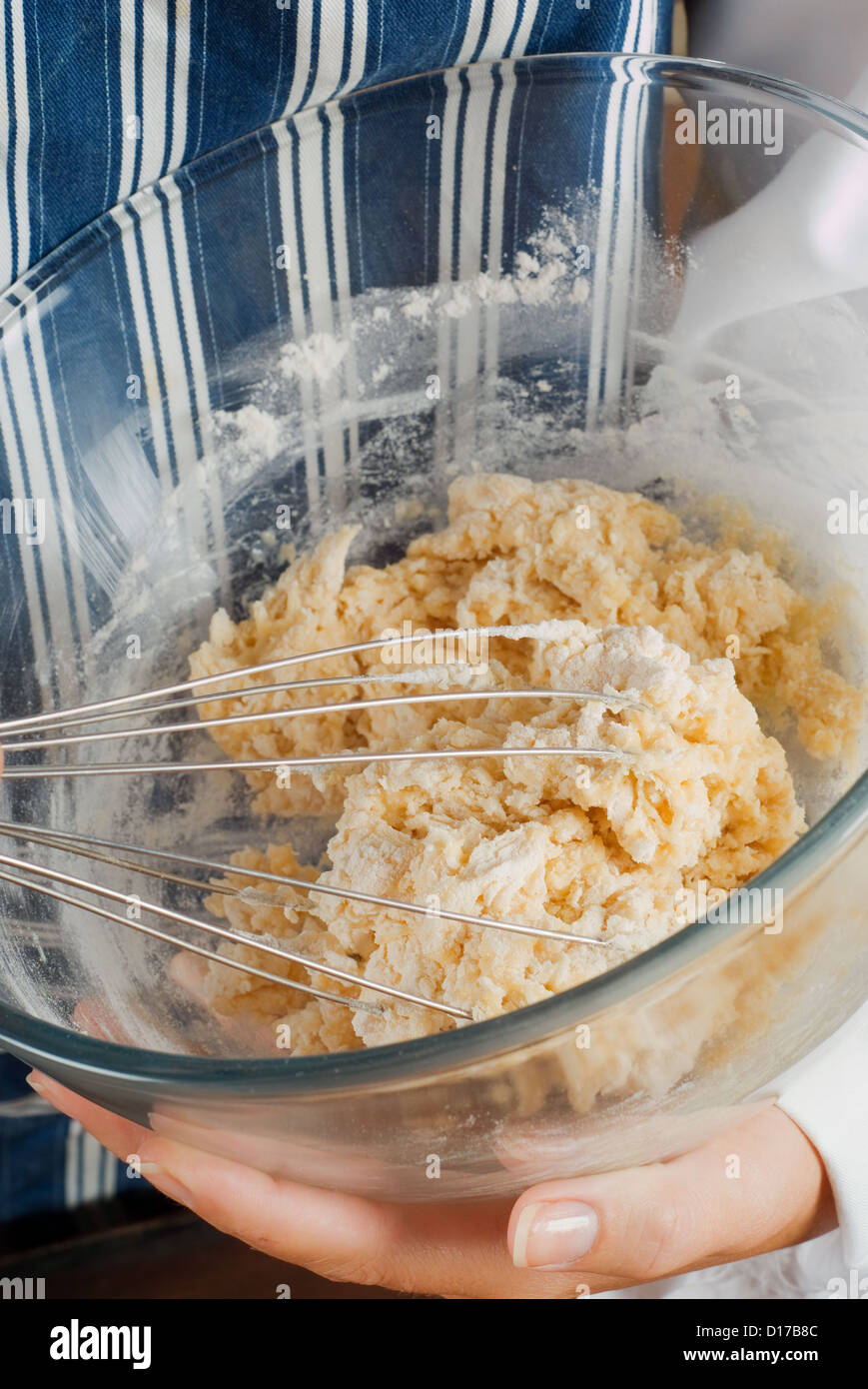 Woman chef cooking or baking and mixing pancake batter with whisk Stock ...