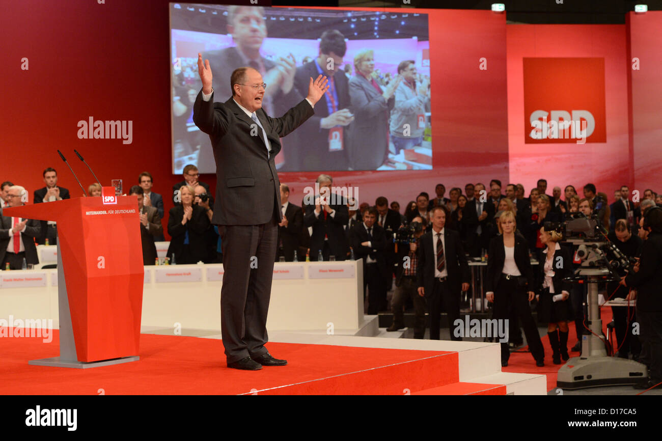 Peer Steinbrueck, SPD chancellor candidate, stands on the podium at the ...