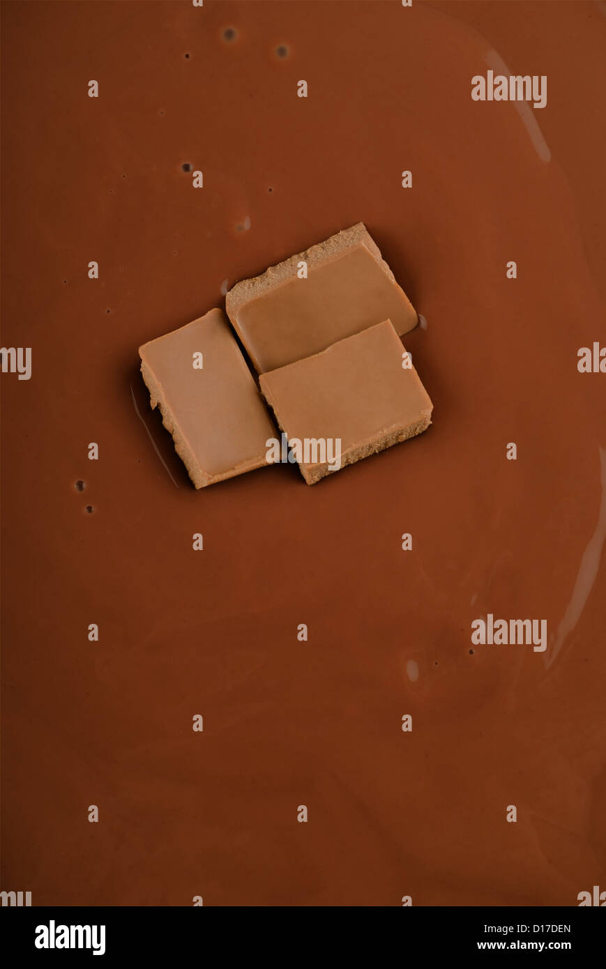 Chocolate floating and melting in dessert sauce Stock Photo - Alamy