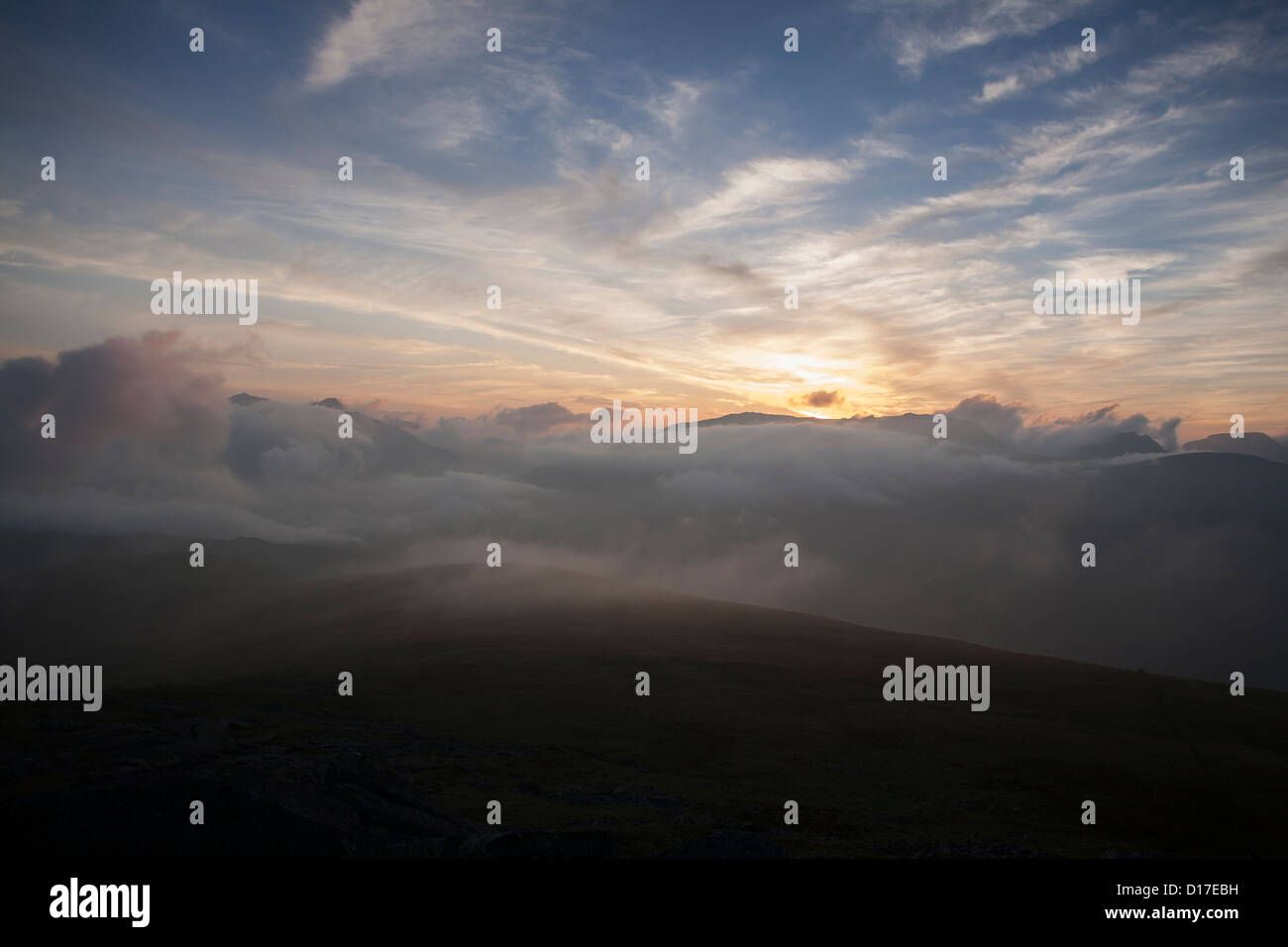The peaks of Snowdon, Crib Goch and Glyder Fawr burried amongst low ...