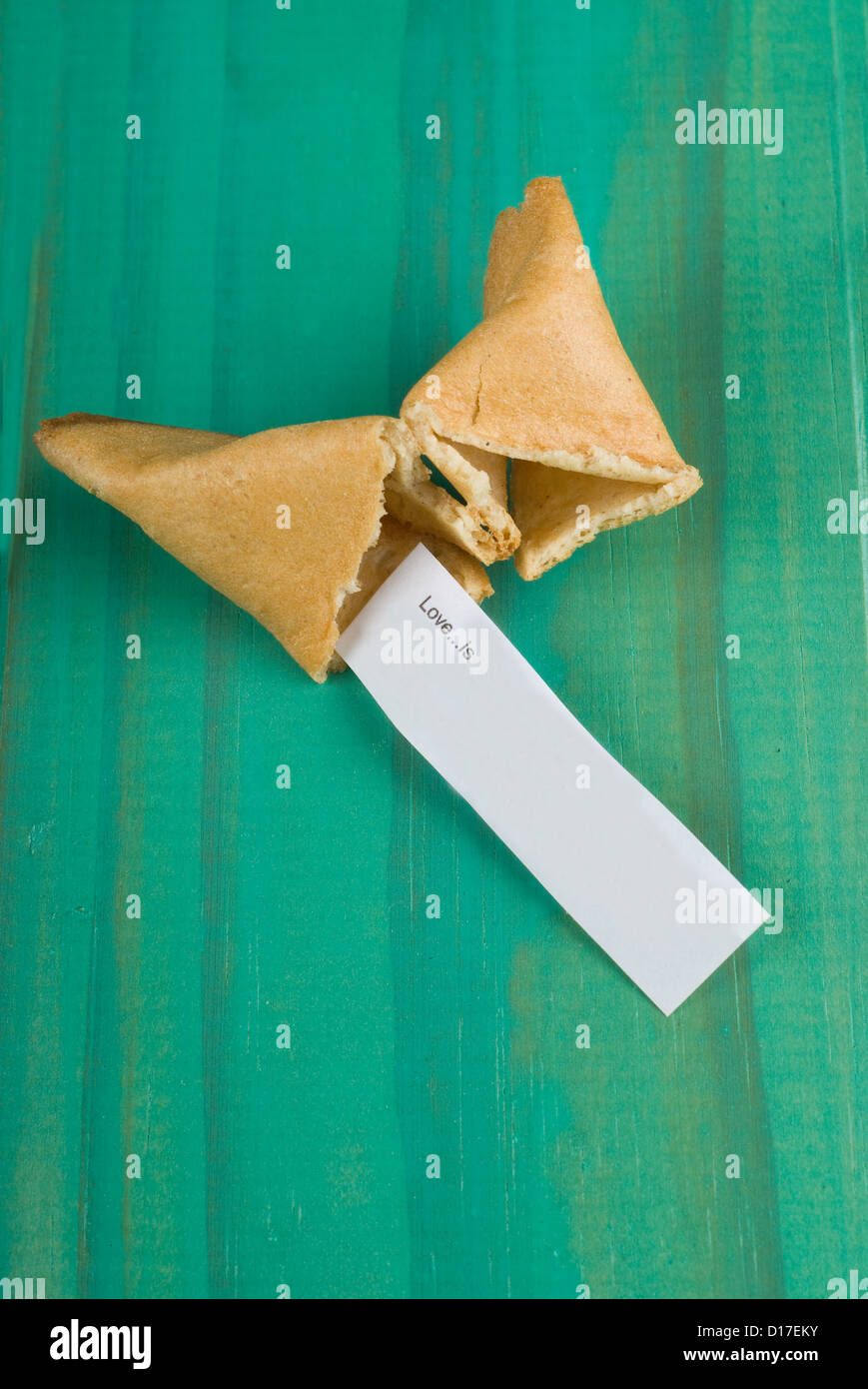 Open fortune cookie with message about love Stock Photo - Alamy