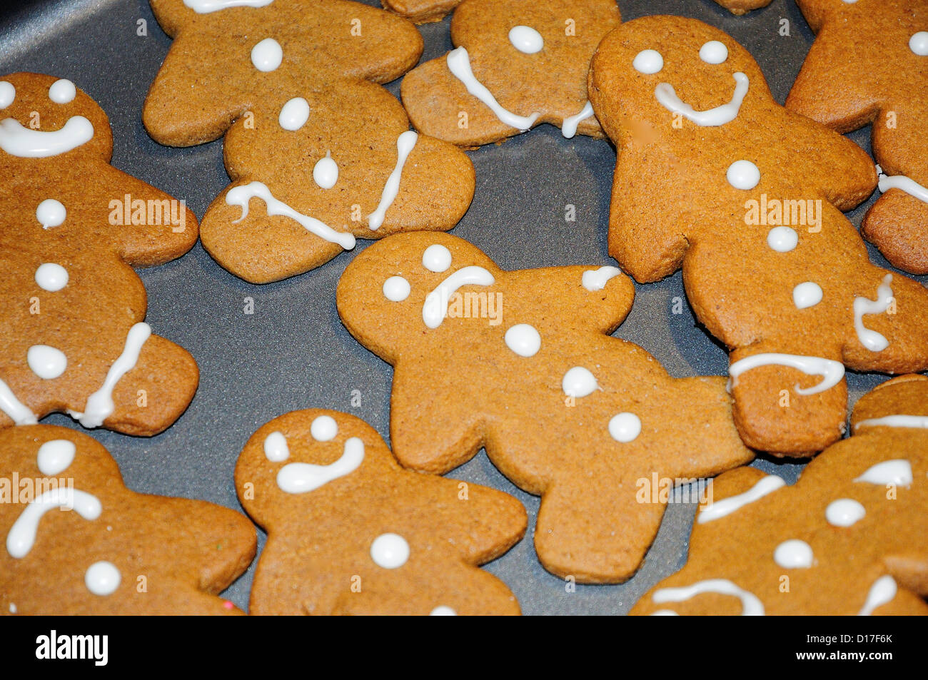 Freshly baked Ginger Bread Men with smiles and frowns Stock Photo - Alamy