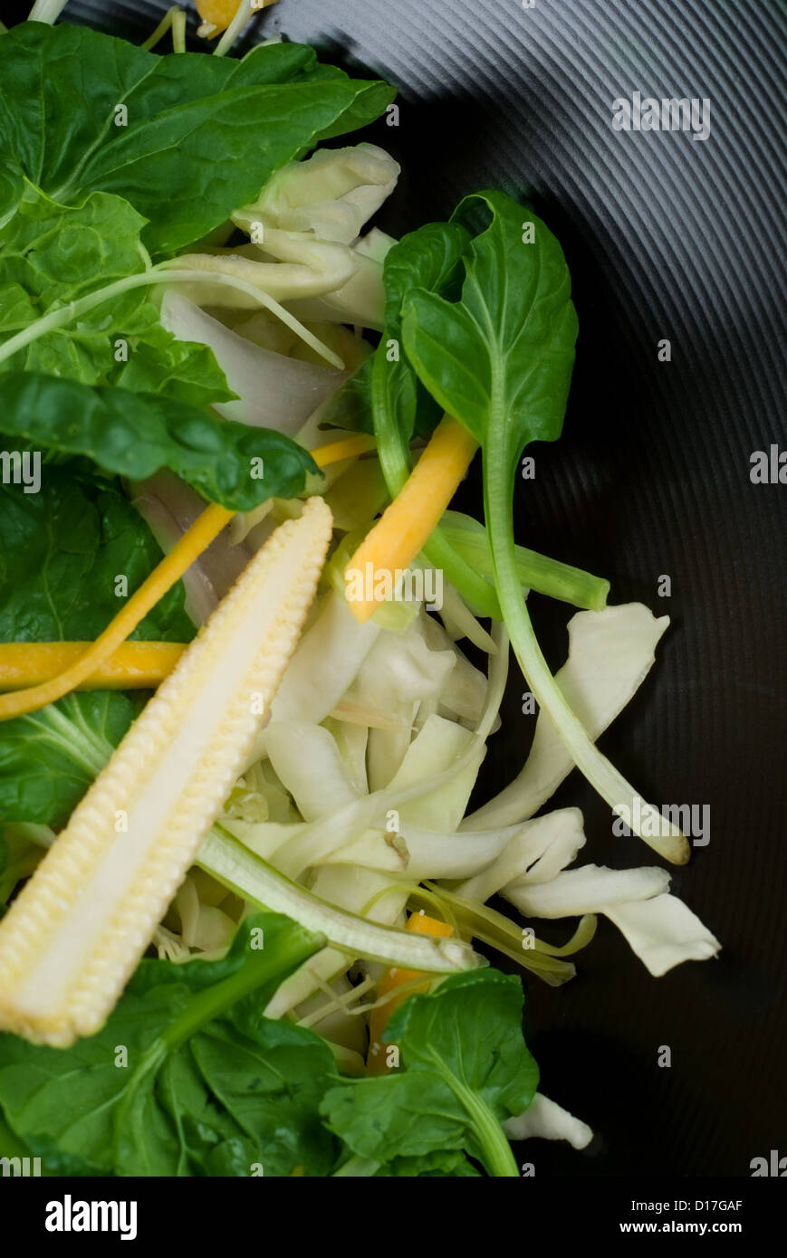 Raw stir fry food in wok ready for cooking Stock Photo - Alamy